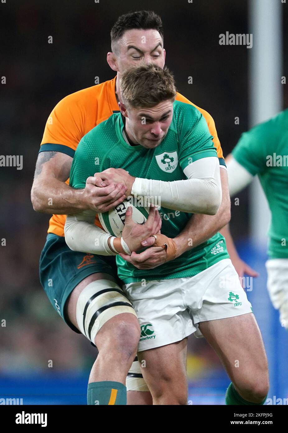 Ireland's Jack Crowley (centre) battles with Australia's Cadeyrn ...