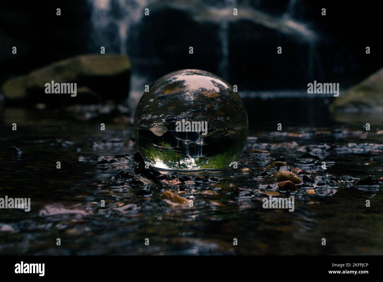 A closeup shot of a crystal ball in a pond Stock Photo - Alamy