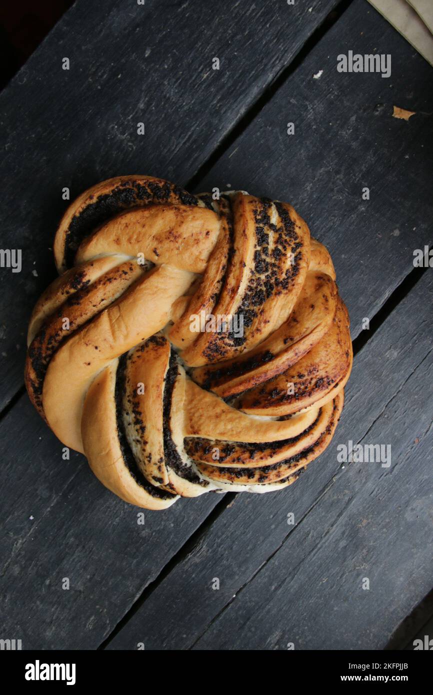 Sweet roll with poppy seeds Stock Photo - Alamy