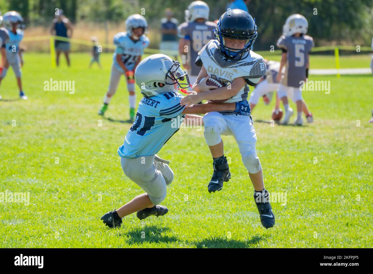 A young football player runs past the defense Stock Photo - Alamy