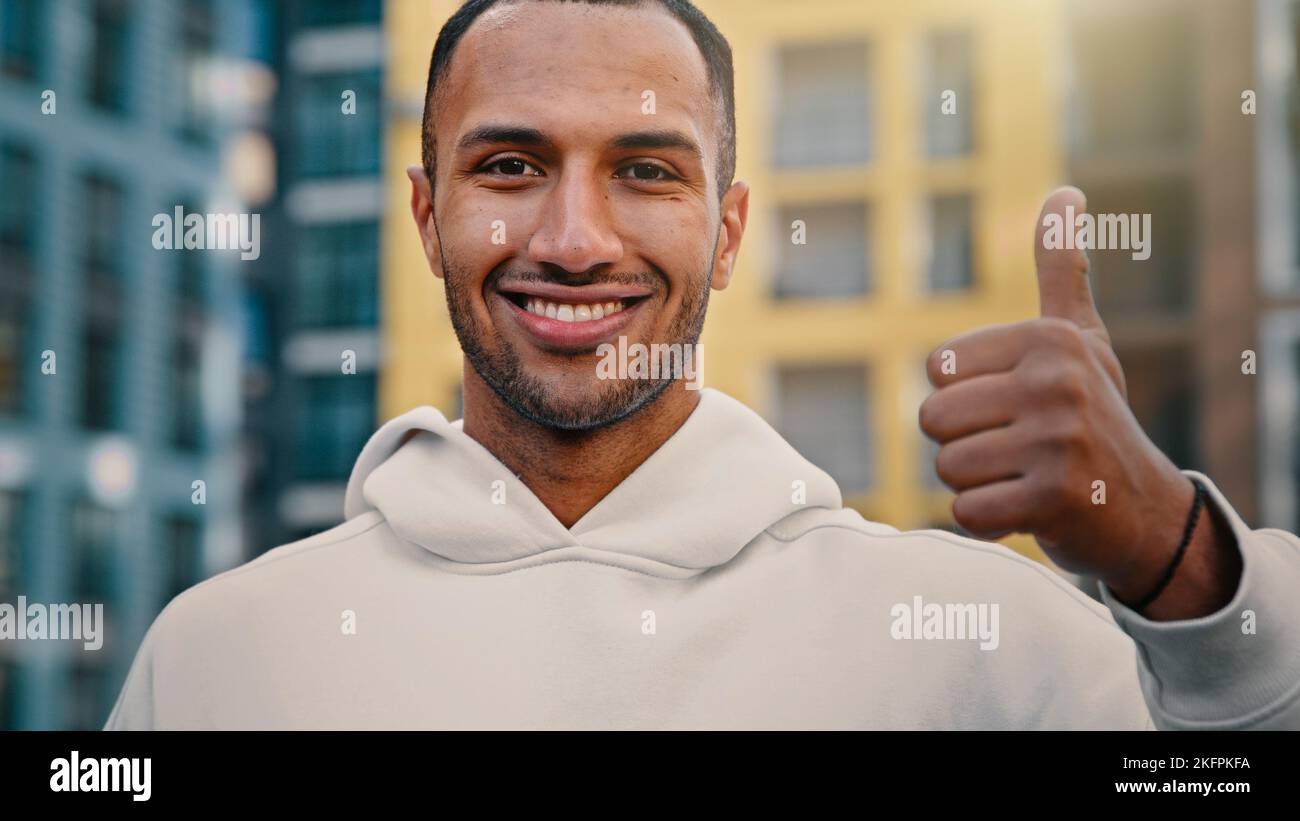 Portrait satisfied attractive man give positive recommendation make ...