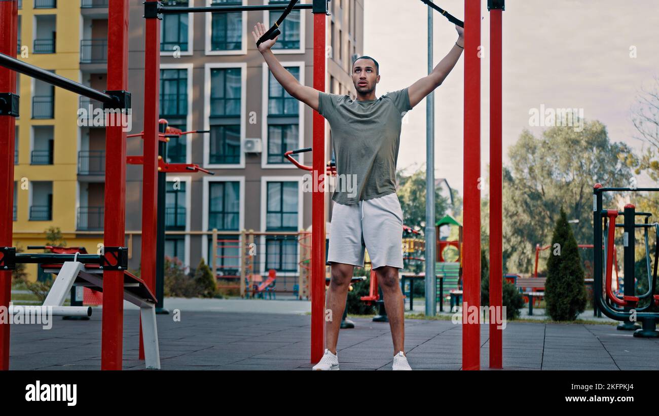 Powerful athlete african latina man sportsman strong guy doing legs ...