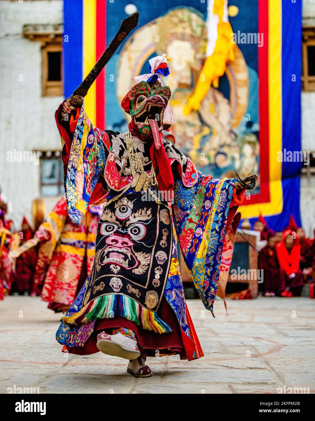 A Tibetan Buddhist in traditional demon ghost clothing for ritual dance ...