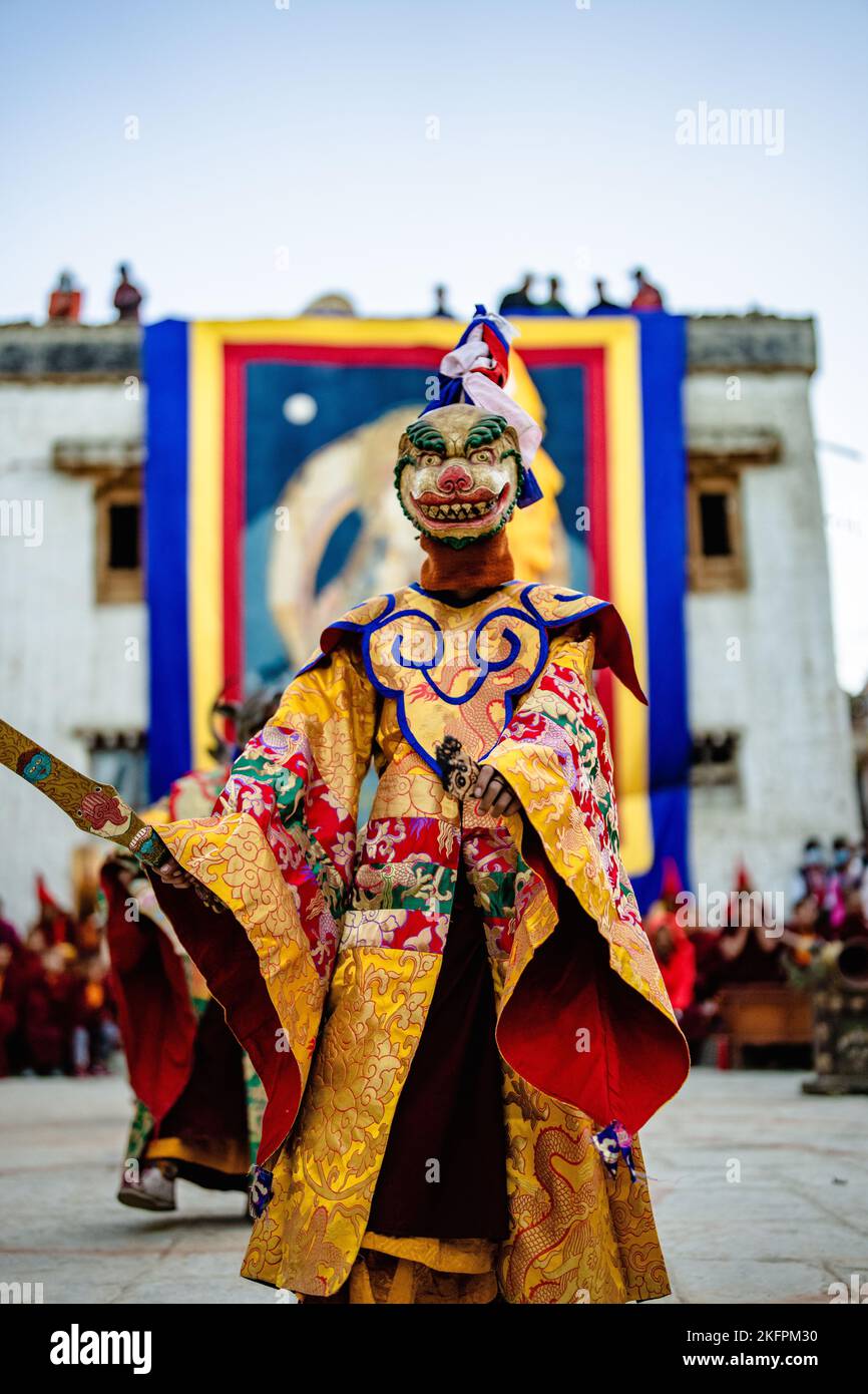 A Tibetan Buddhist in traditional demon ghost clothing for ritual dance ...