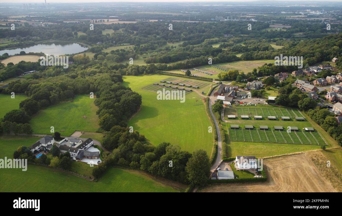 An aerial view of a chicken farm and coops near a lake Stock Photo - Alamy