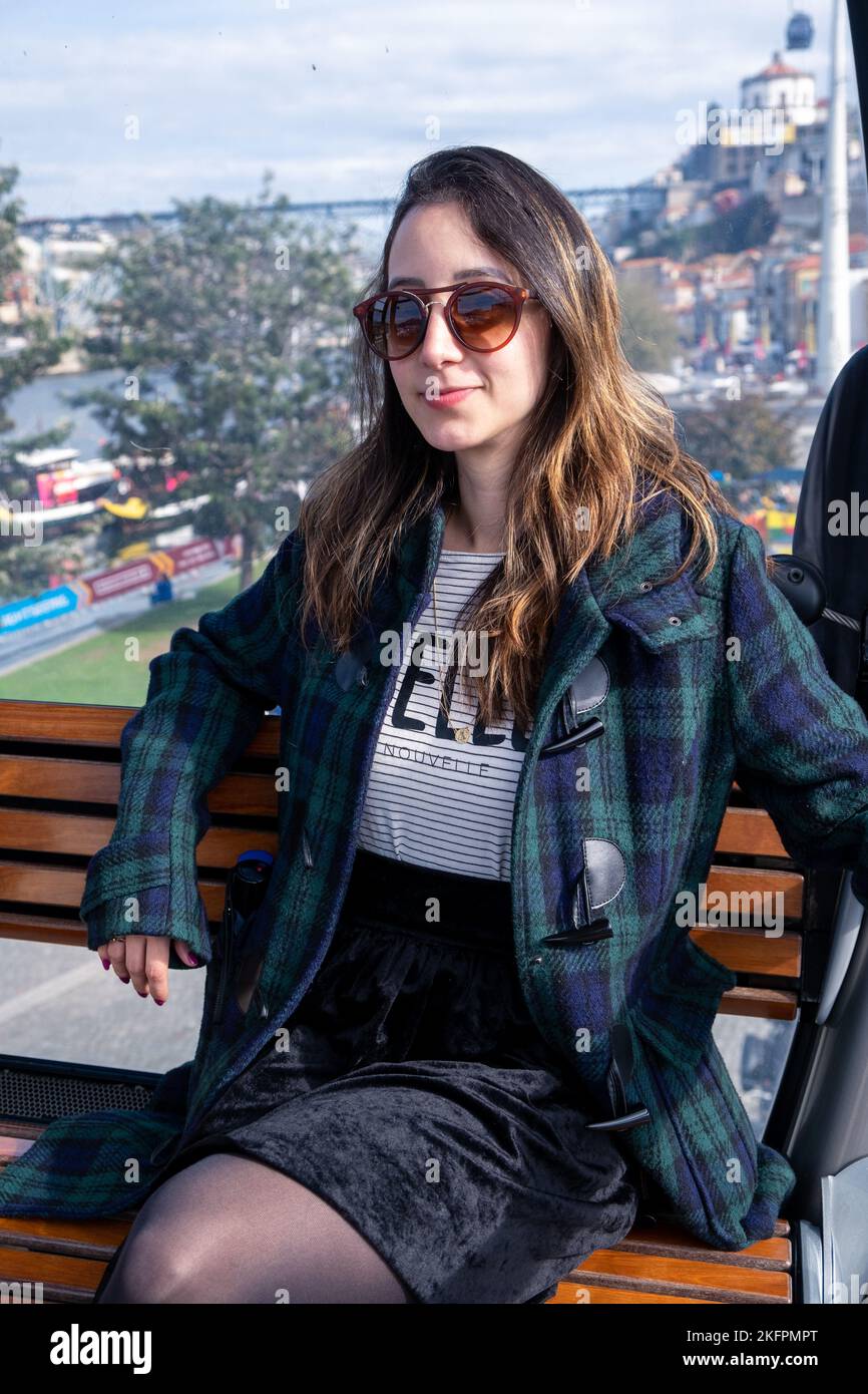 Young woman tourist in a cable car in Portugal Stock Photo - Alamy