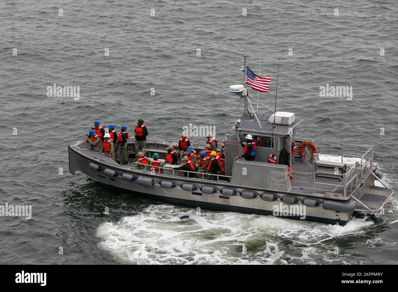 U.S. Navy Sailors with Naval Support Element and Merchant Mariners with ...
