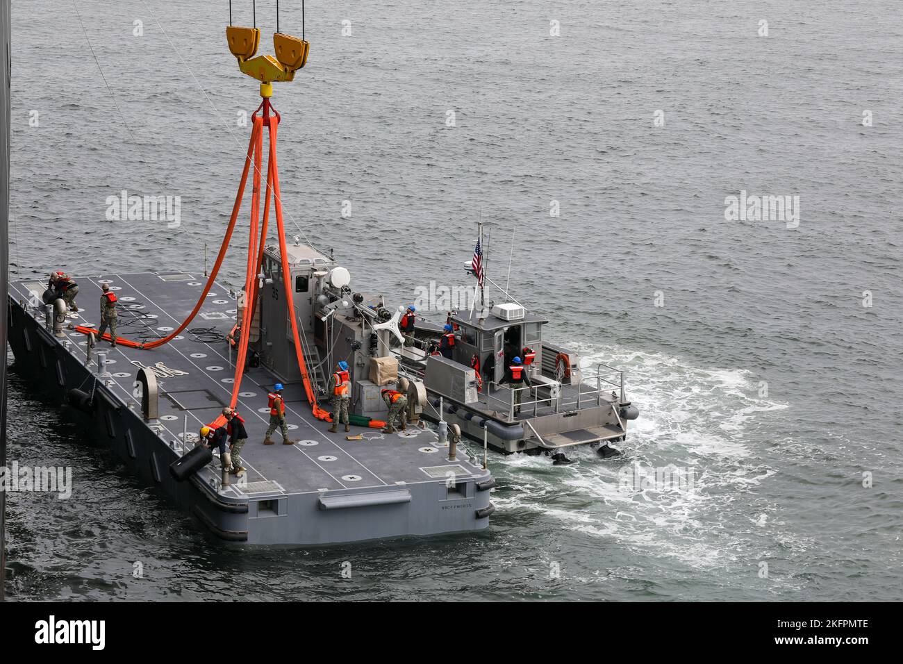 U.S. Navy Sailors with Naval Support Element and Merchant Mariners with ...
