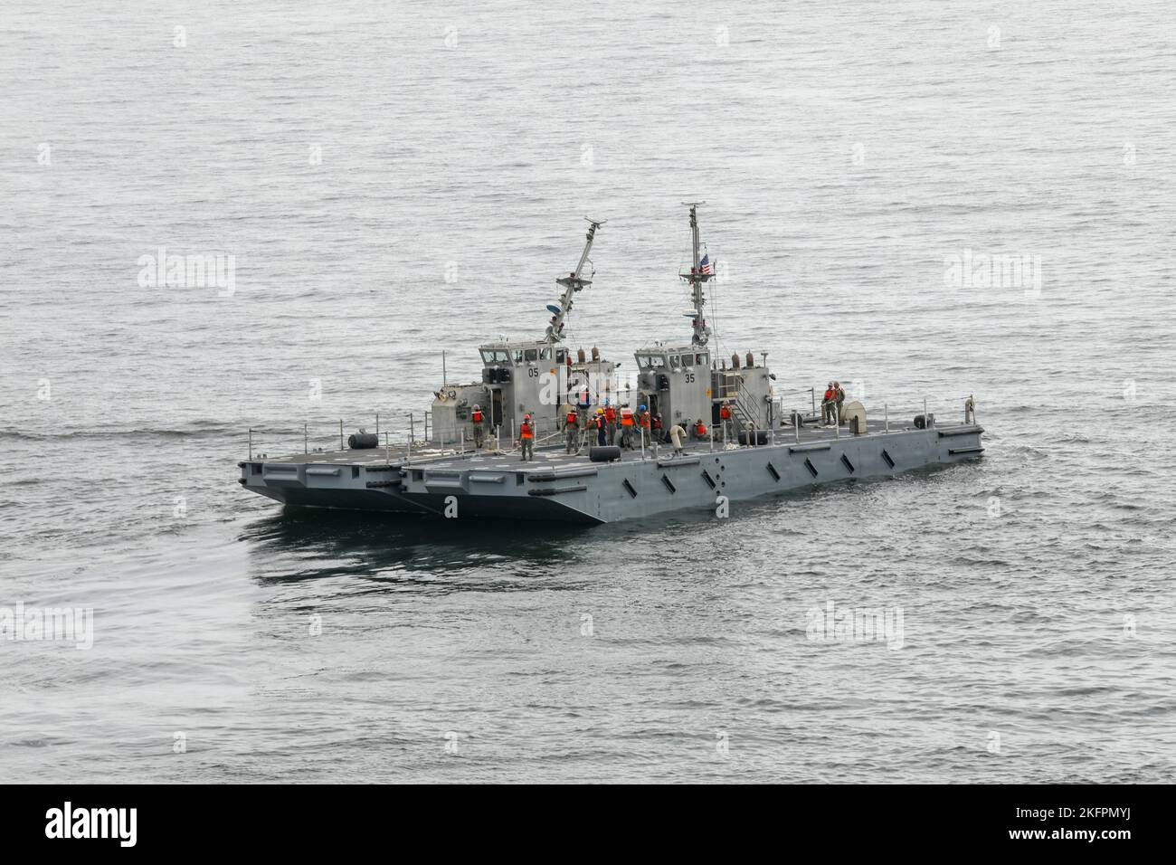 U.S. Navy Sailors with Naval Support Element and Merchant Mariners with ...