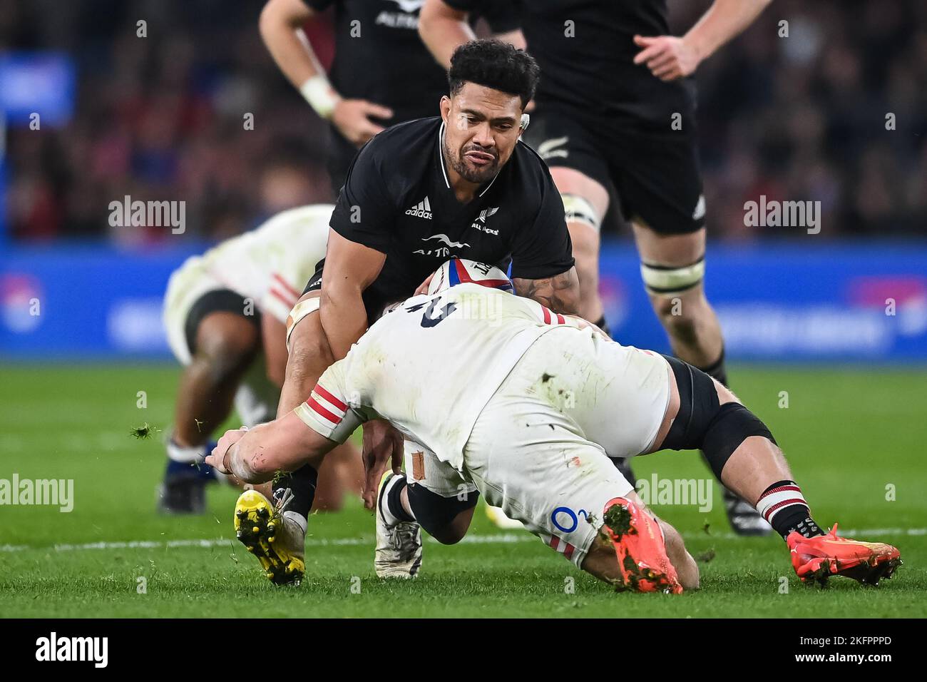 Ardie Savea of New Zealand is tackled by Luke Cowan-Dickie of England ...