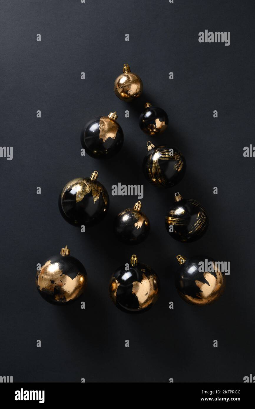 Alternative Christmas tree with black and golden decorative balls on ...