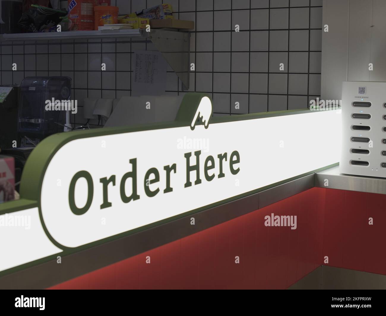 A closeup of "order here" sign in a restaurant Stock Photo - Alamy