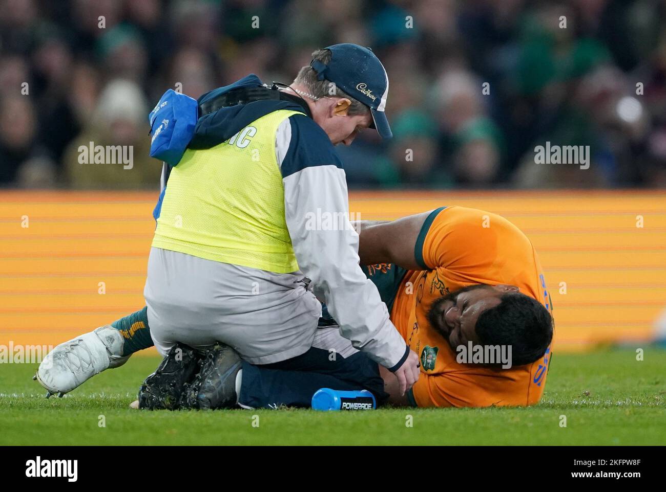 Australia's Taniela Tupou receives treatment for an injury during the ...