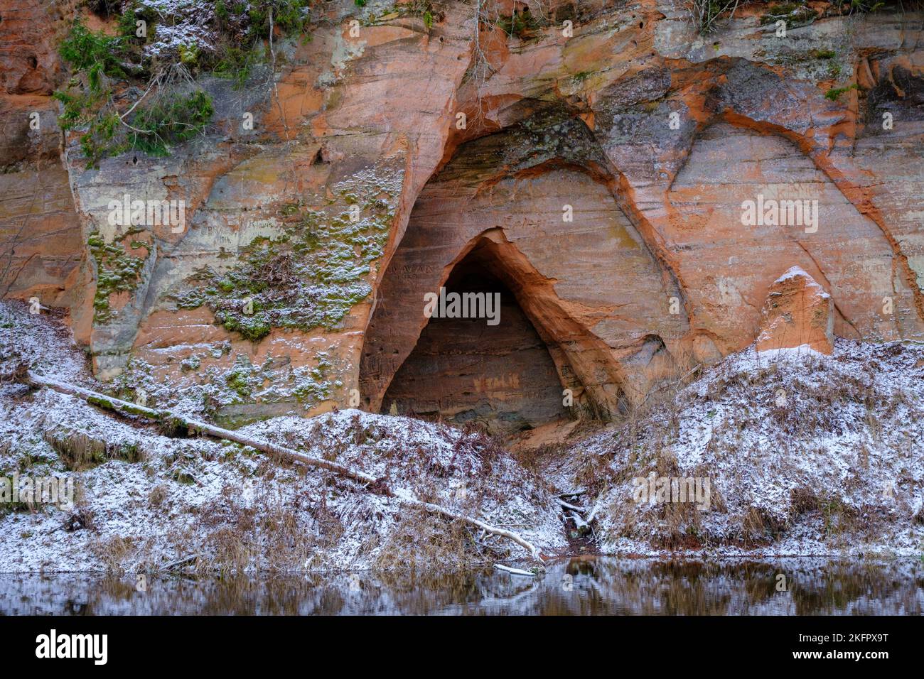 A view of Angel Cave, a red sandstone cliff. Skanaiskalns nature park ...