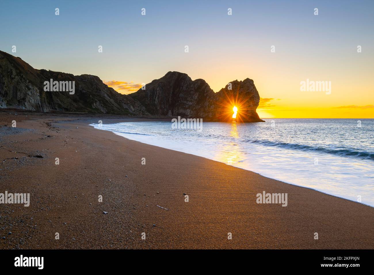 A spectacular sunrise as the sun shines through the key hole of the ...