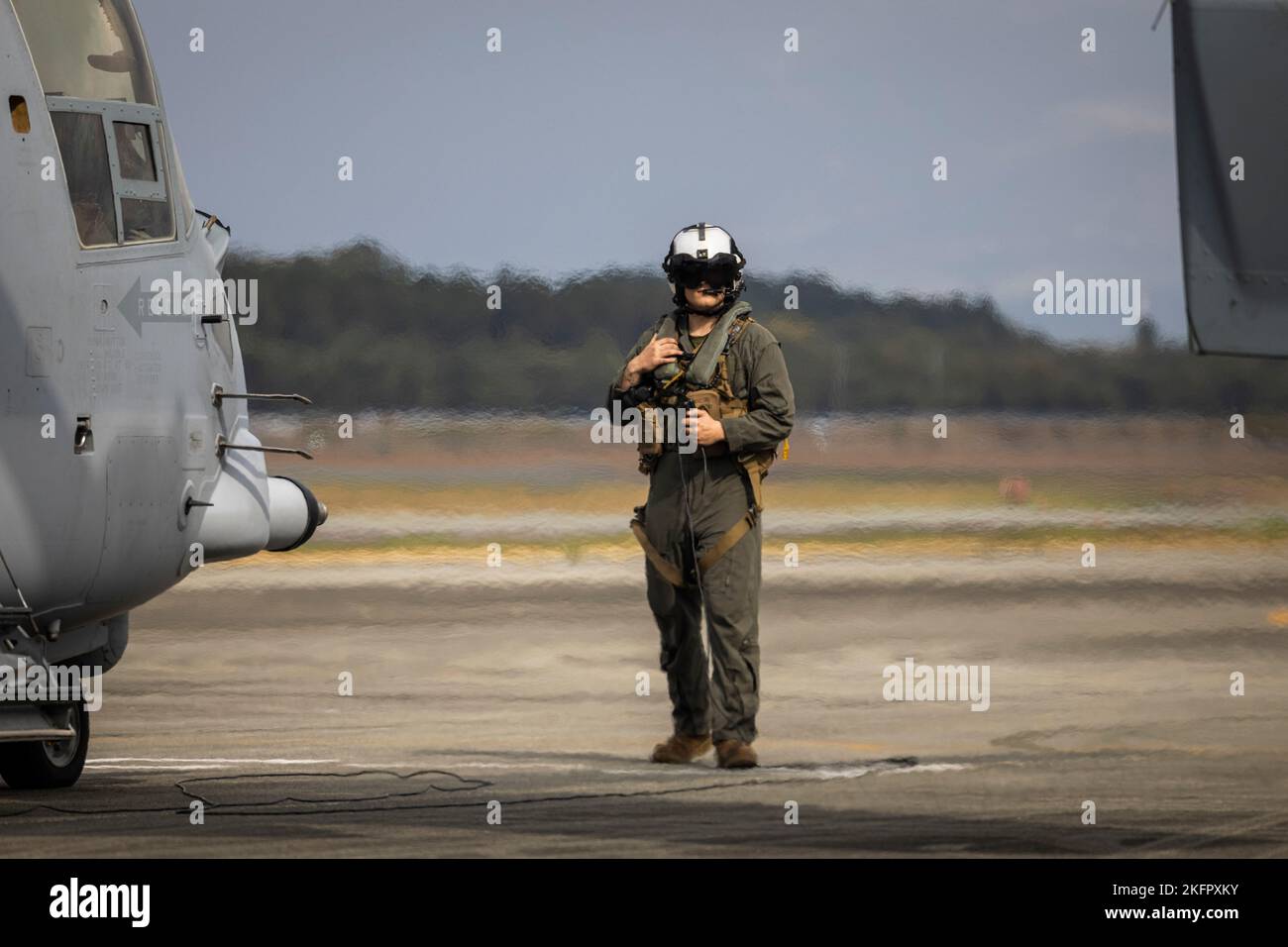 U.S. Marine Corps Cpl. Ryan Lewis, an MV-22B Osprey crew chief, with ...