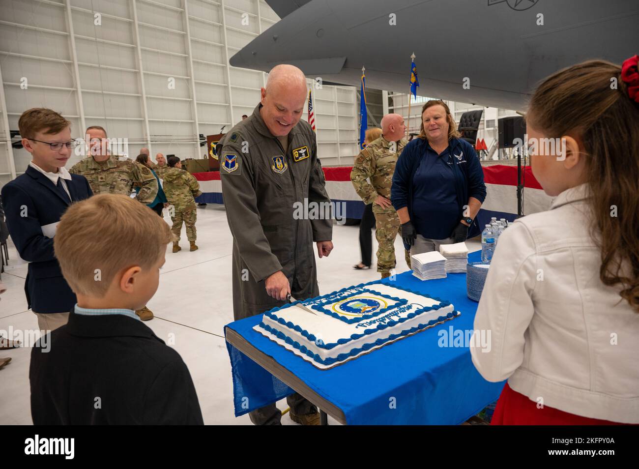 Lt. Col. Jamie Akers, 911th Operations Group commander, cuts a cake ...
