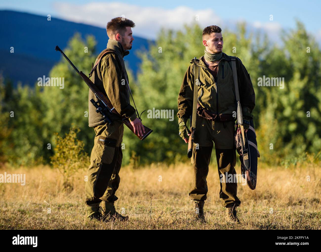 Gamekeepers walk mountains background. Gamekeepers sunny fall day ...