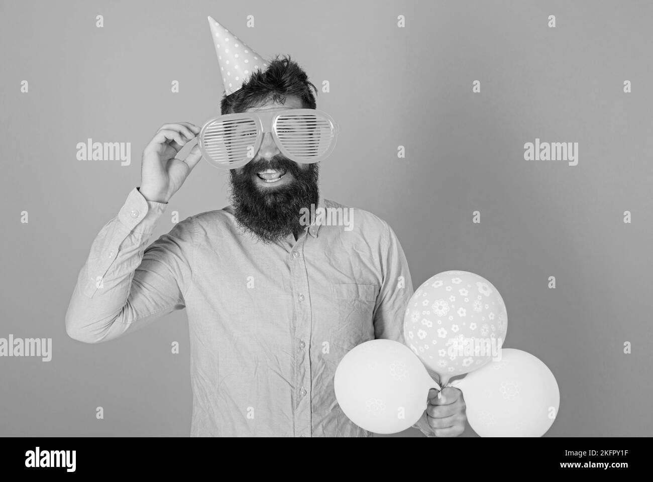 Happy Bearded Man In Huge Glasses Posing With Bright Balloons Fun Concept Comedian With Crazy