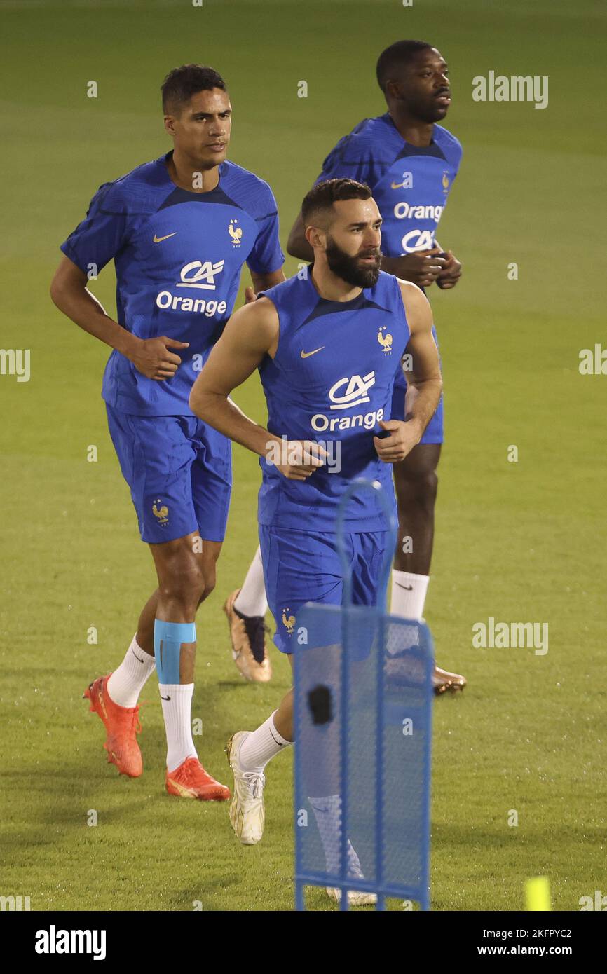 Doha, Qatar - November 19, 2022, Karim Benzema, behind Raphael Varane ...