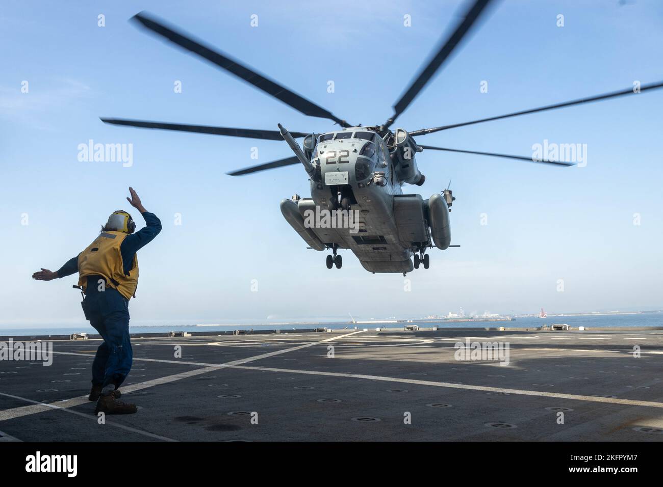 Ryan Akerson, a boatswain’s mate on the U.S.N.S Sacagawea, directs a CH ...