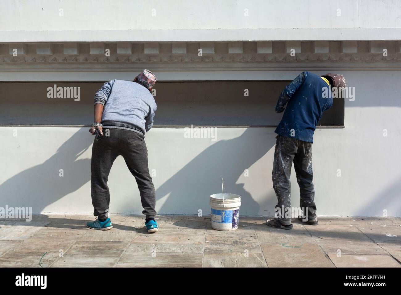 Workers repair a temple wall. Shechen Tennyi Dargyeling Monastery ...