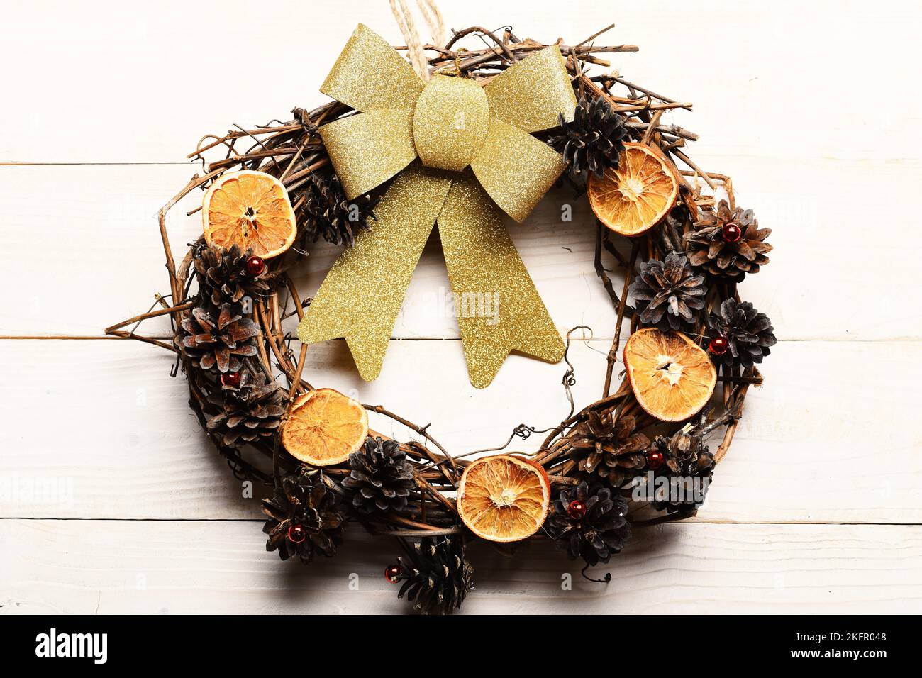 Wreath made of grape branches with dry citrus slices Stock Photo - Alamy