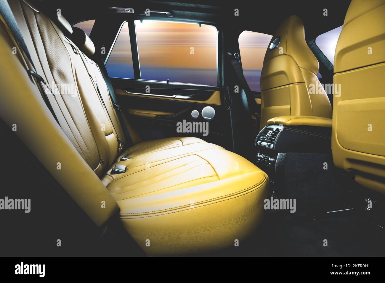 Back passenger seats in modern luxury car, red sand leather Stock Photo ...