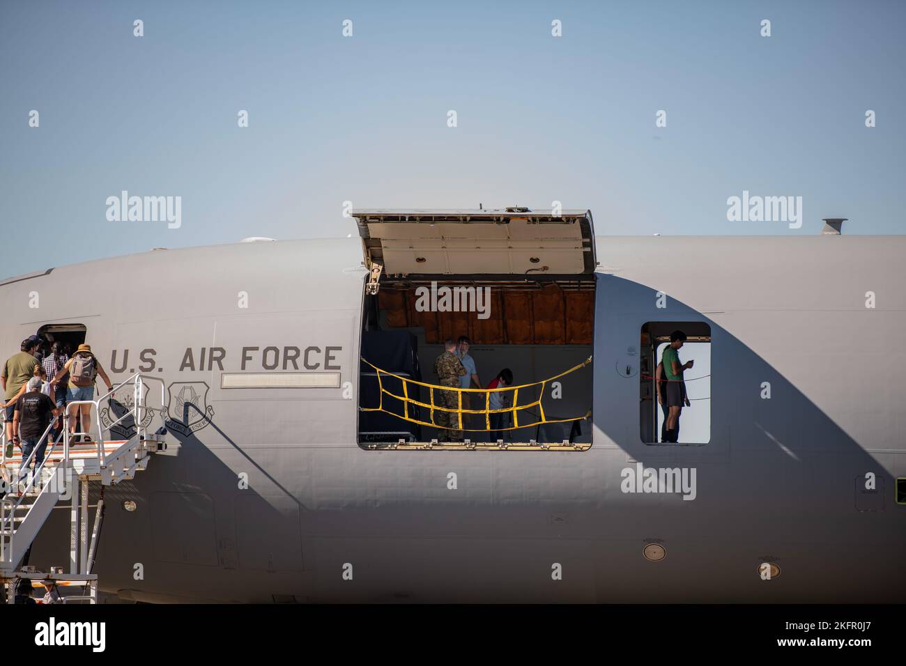U.S. Air Force Senior Airman Landon Marks, center, 660th Aircraft ...