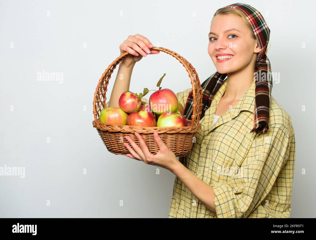 Lady farmer or gardener proud of her harvest. Natural gifts concept ...