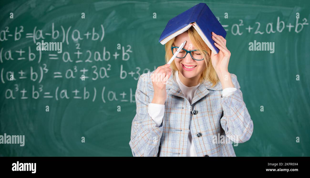 Improve memory skill. Woman teacher with book as roof on head ...