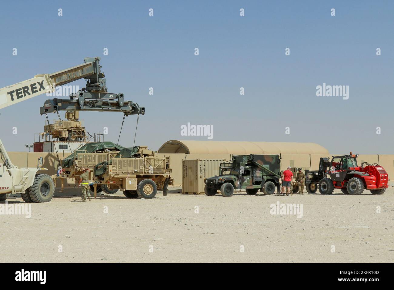 Soldiers from the 35th Infantry Division receive signal equipment on ...