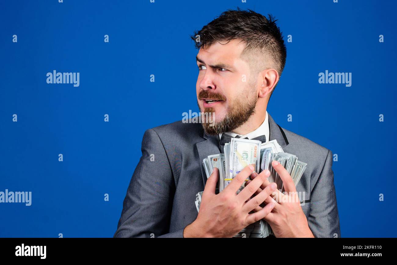 Man bearded businessman hold pile money blue background. Businessman ...