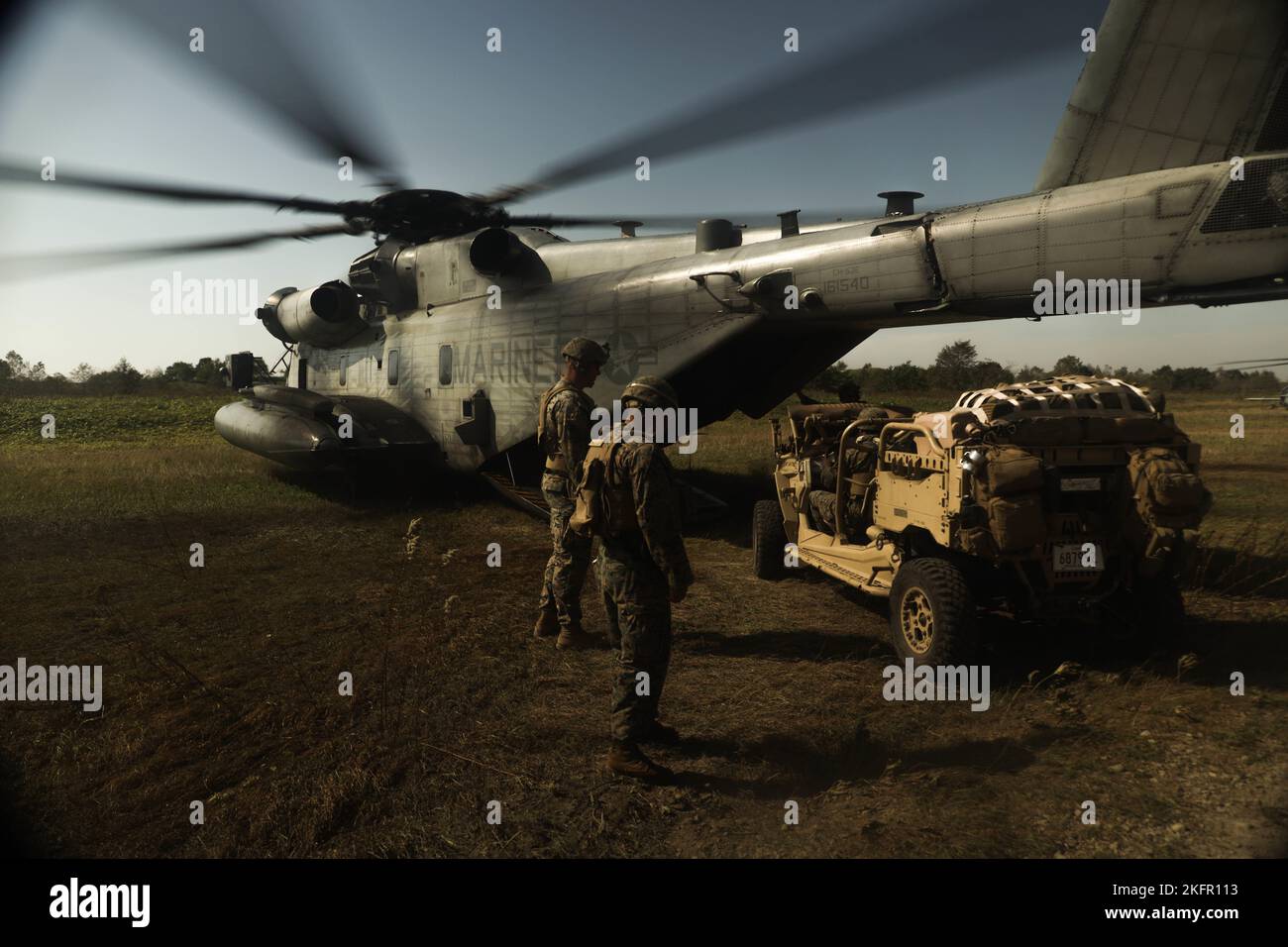 U.S. Marines with 3d Battalion, 3d Marines, 3d Marine Division load a ...