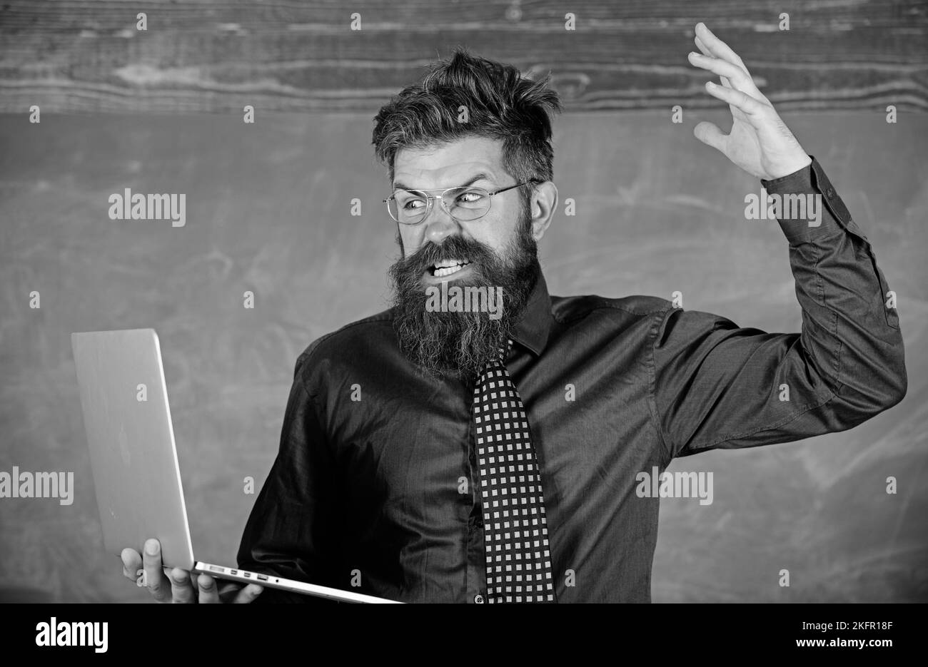 Can not get used to modern technology. Teacher bearded man with modern ...