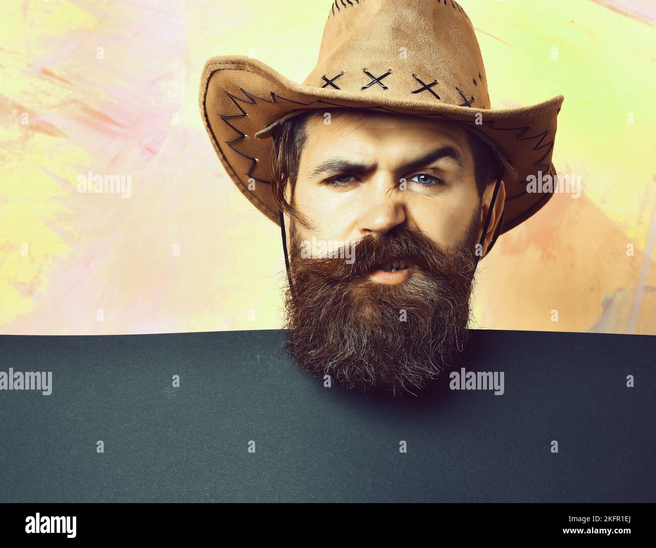 Bearded brutal caucasian hipster cowboy Stock Photo - Alamy