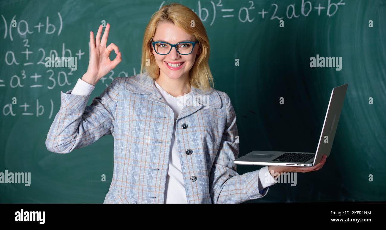 Educator smart clever lady with modern laptop searching information ...