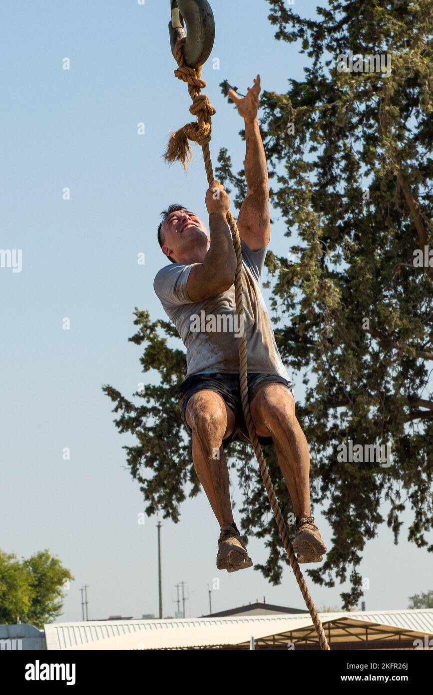 A soldier assigned to the Spanish Patriot Unit climbs a rope during the ...