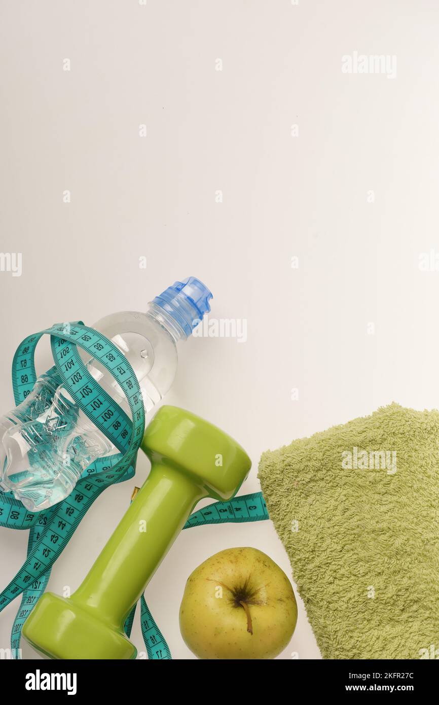 Barbell made of plastic near juicy green apple Stock Photo - Alamy