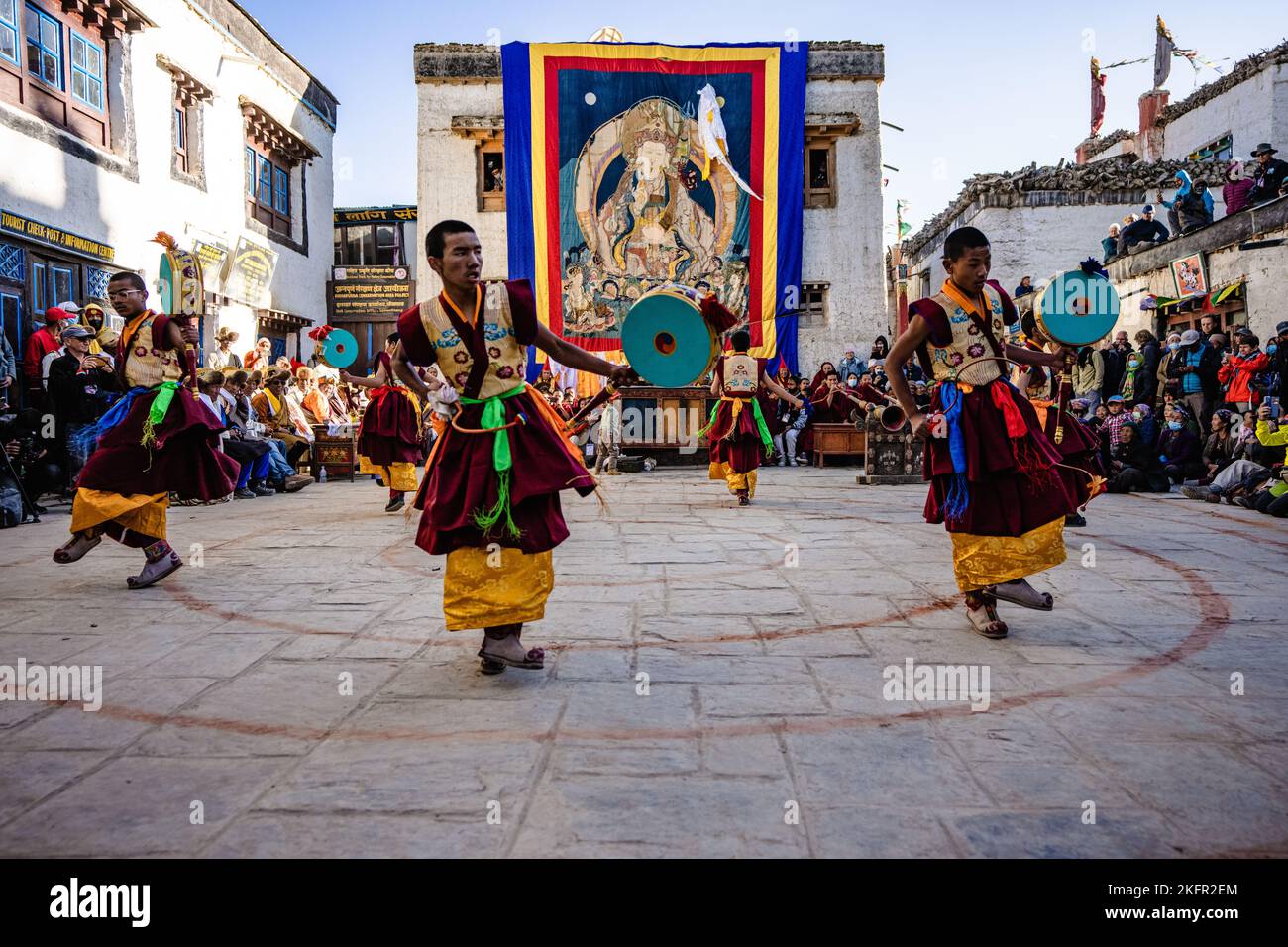A group of Tibetan Buddhists in traditional clothing performing Ritual ...