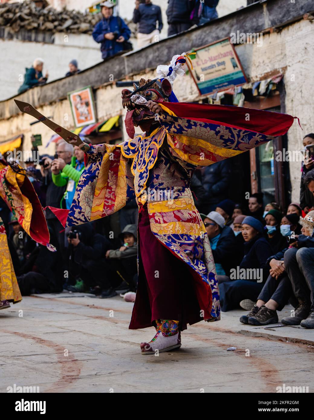 A monk in traditional demon ghost outfit performing Dance at the Tiji ...