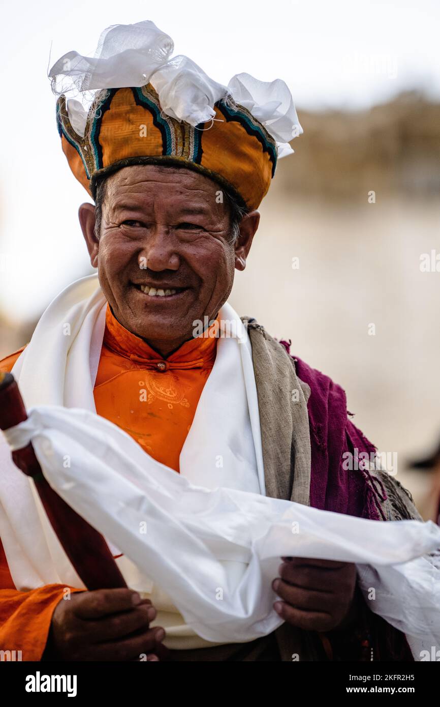 A happy Elder monk in traditional outfir at the Tibetan Buddhist Tiji ...
