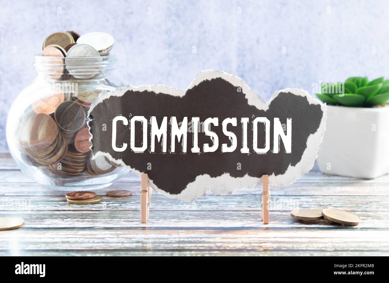 On the desktop are notebooks, a pen and a red folder for papers with ...