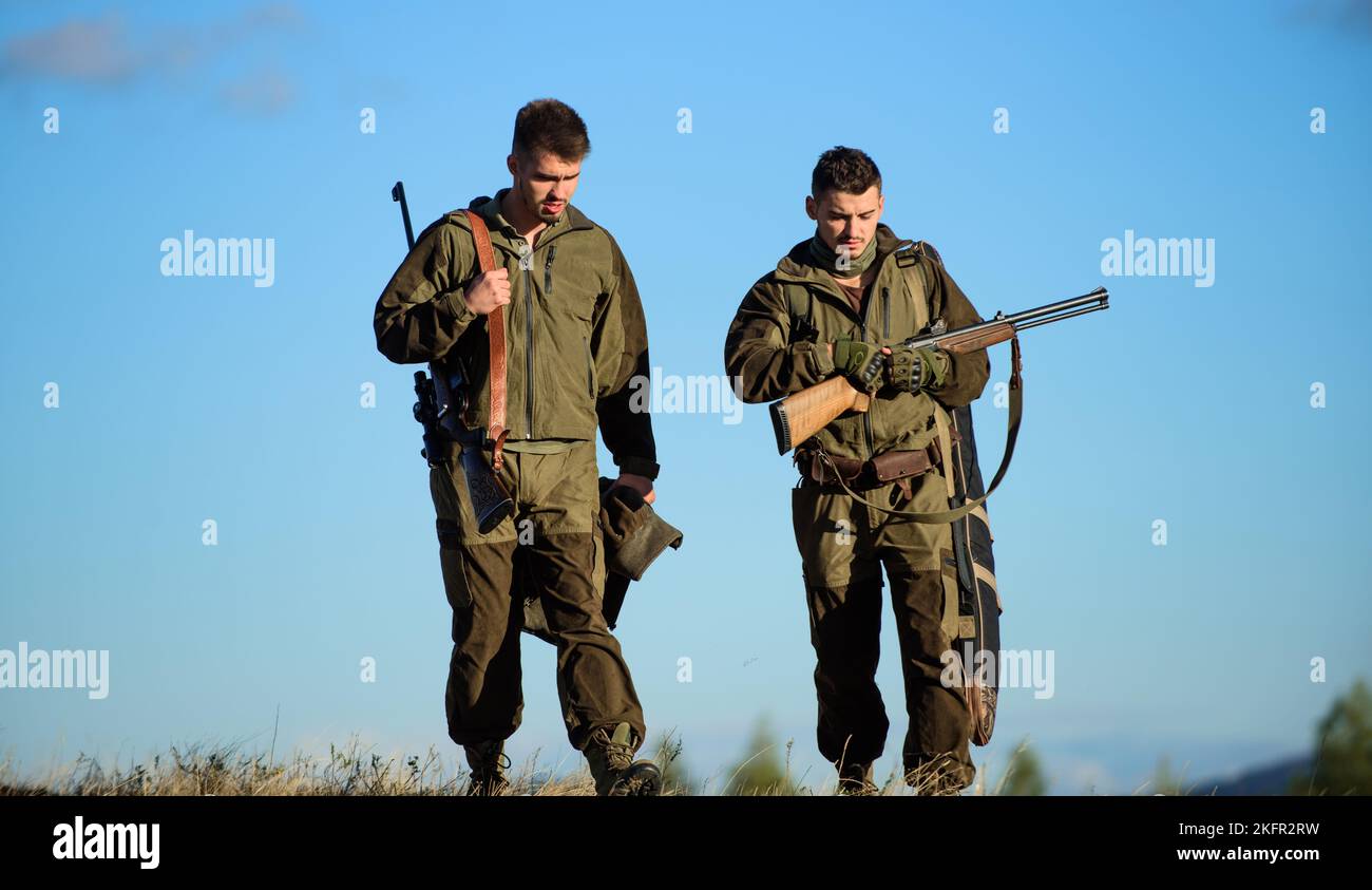 Hunters with rifles in nature environment. Hunter friend enjoy leisure ...
