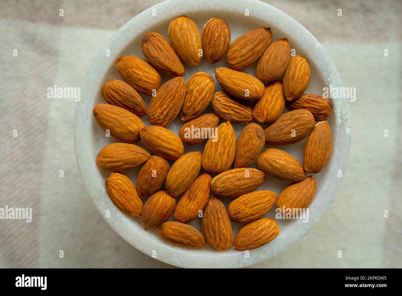 Close-up of almonds on a beautiful stand, Nuts are healthy. Organic ...