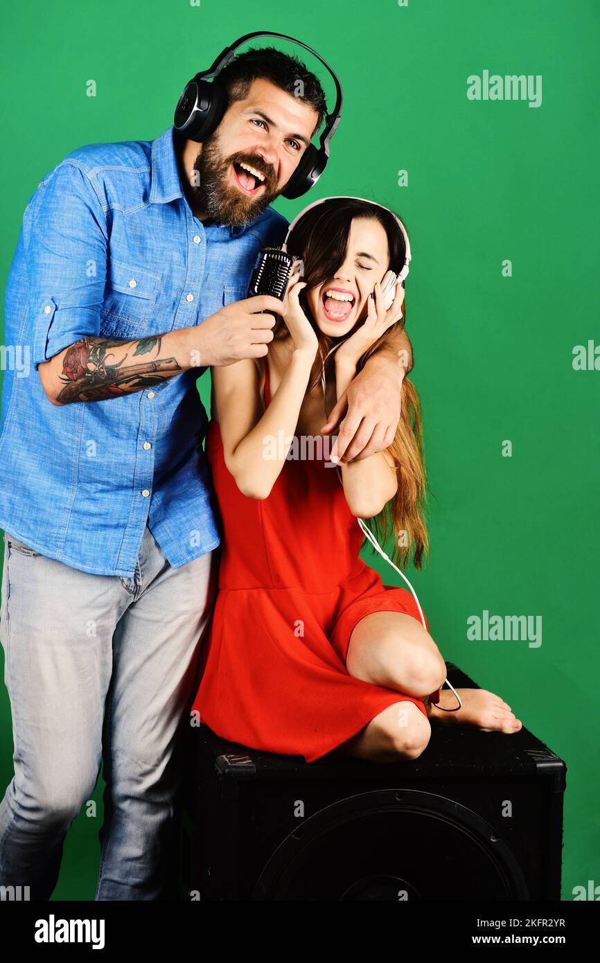 Music fans with smiling faces listen to music Stock Photo - Alamy
