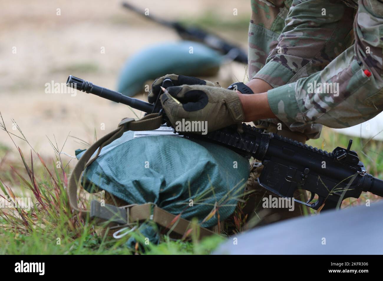 A Soldiers the United States Army Reserves squad makes an adjustments ...