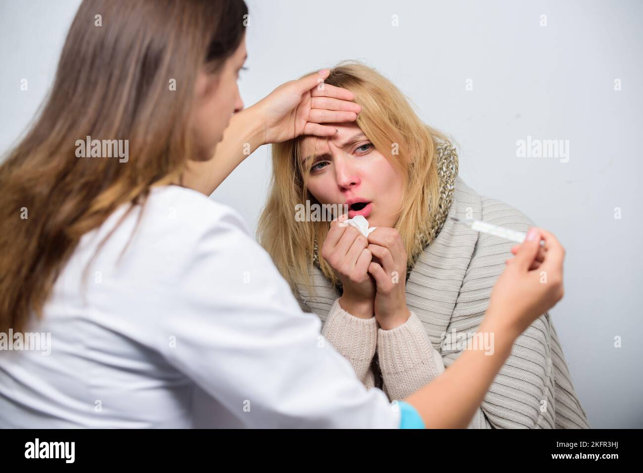Adult fever symptoms. Treatment and when to call doctor. Doctor woman ...