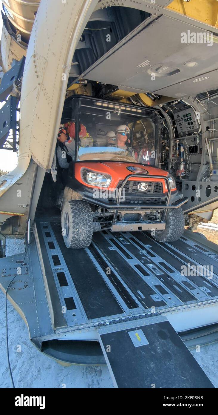 A civilian search and rescue vehicle exits a CH-47F Chinook helicopter ...