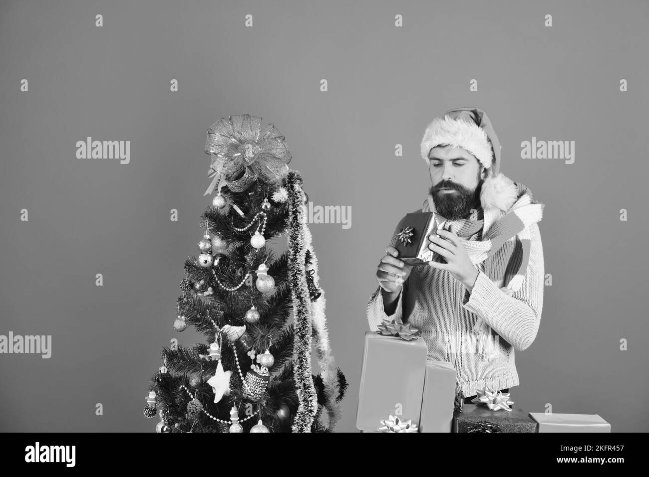 Man with beard and curious face on blue background Stock Photo - Alamy